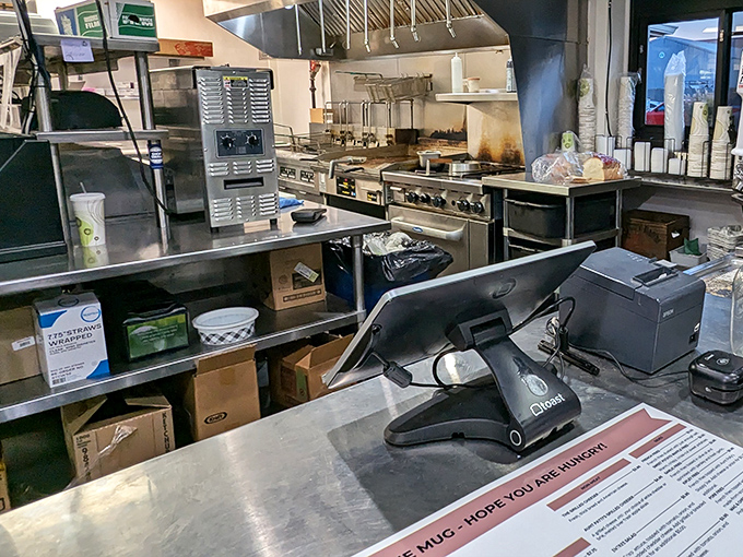 Behind the scenes where burger dreams become reality. The kitchen's organized chaos is a beautiful thing to behold.