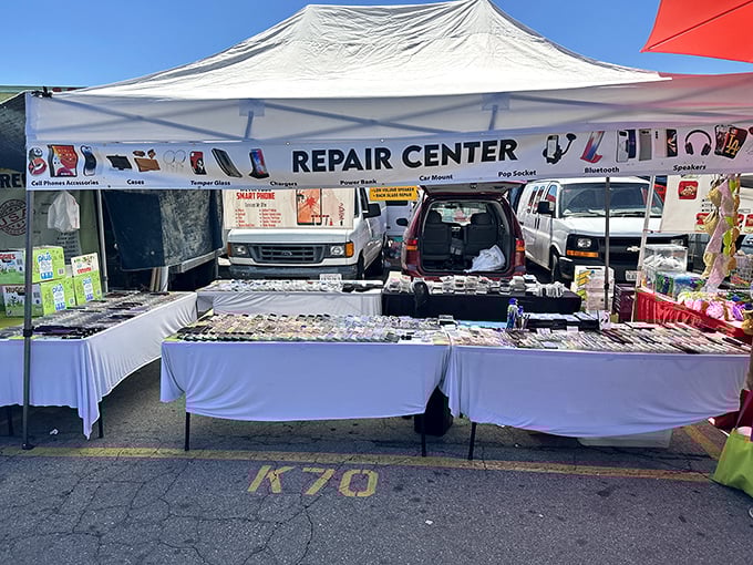 The swap meet's version of the Genius Bar, where cracked screens and broken gadgets get a second chance at life.