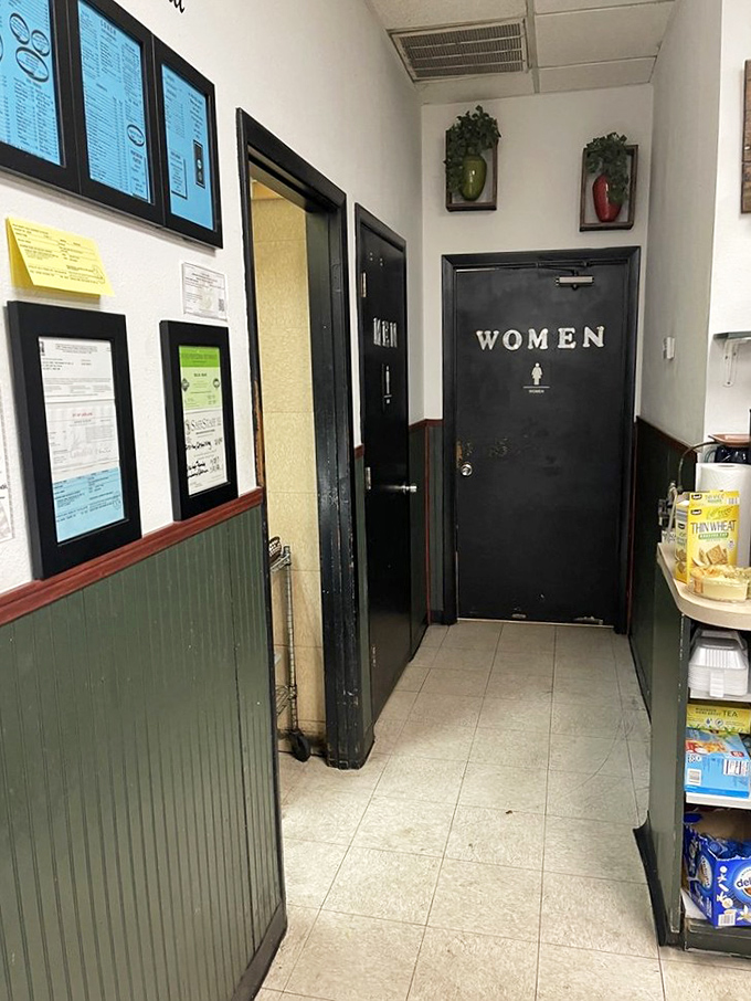 Even the restroom sign maintains that homey charm, because attention to detail matters in every corner here.