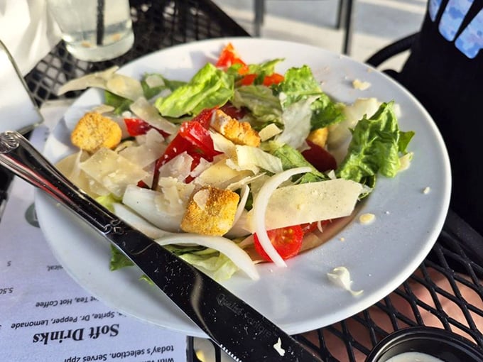 Even the salads show careful consideration—crisp greens, vibrant peppers, and delicate shavings of cheese create a fresh counterpoint to the heartier offerings.