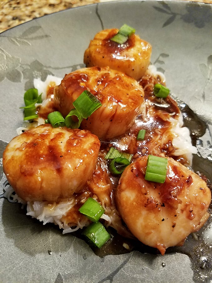 These caramelized scallops sitting atop fluffy rice look like they're ready for their close-up. Sweet, succulent ocean candy for grown-ups.