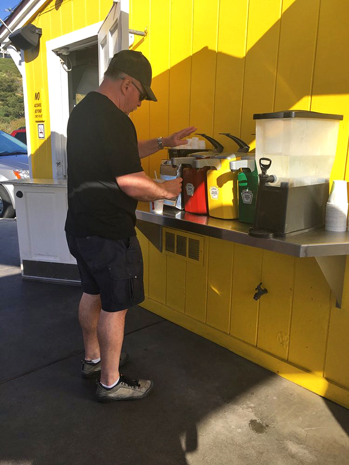The condiment station: where self-service meets self-expression and every squeeze bottle holds the power to elevate your burger experience.