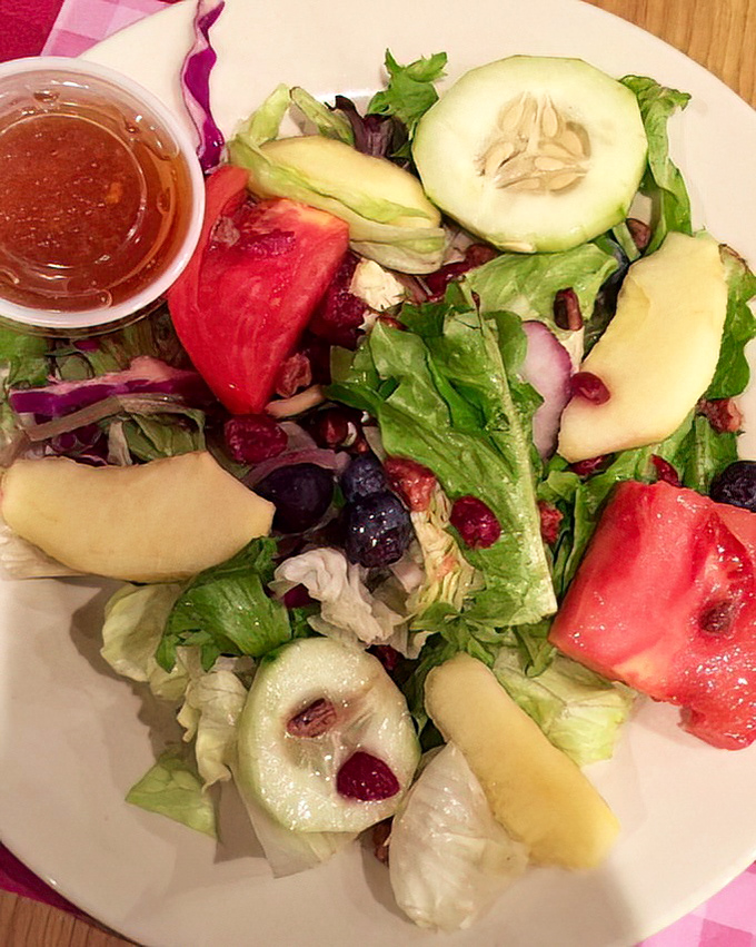 Even the side salad gets the royal treatment with fresh ingredients that actually taste like sunshine.