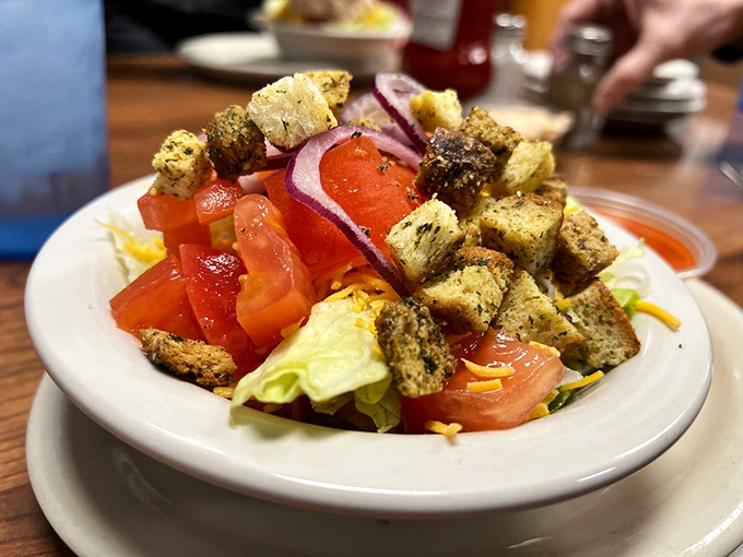 A side salad that proves vegetables can have personality too, with homemade croutons that crunch like they mean it.