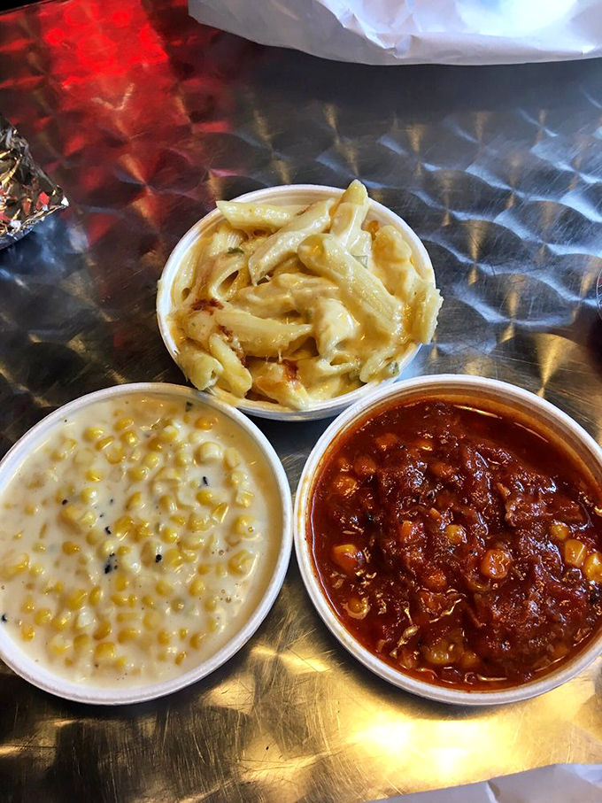 The holy trinity of sides: creamy mac and cheese, sweet corn pudding, and beans that have clearly been introduced to some serious flavor.