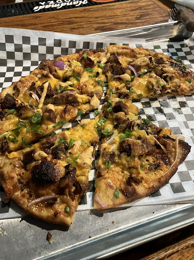 Barbecue reimagined as pizza proves that smoked brisket plays well with others, especially when "others" include melted cheese and green onions.