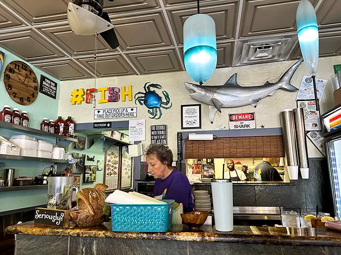 Behind every great seafood joint is a dedicated crew who knows their grouper from their groupies. The magic happens behind that counter.