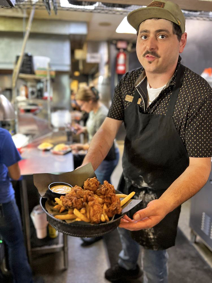 In the kitchen, true artisans work their magic, presenting crispy delights with the casual confidence that comes from knowing they've mastered their craft.