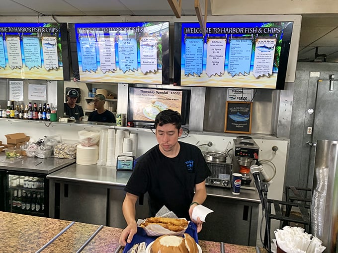 Where the magic happens! The kitchen crew works their seafood sorcery, transforming simple ingredients into dishes that haunt your dreams.