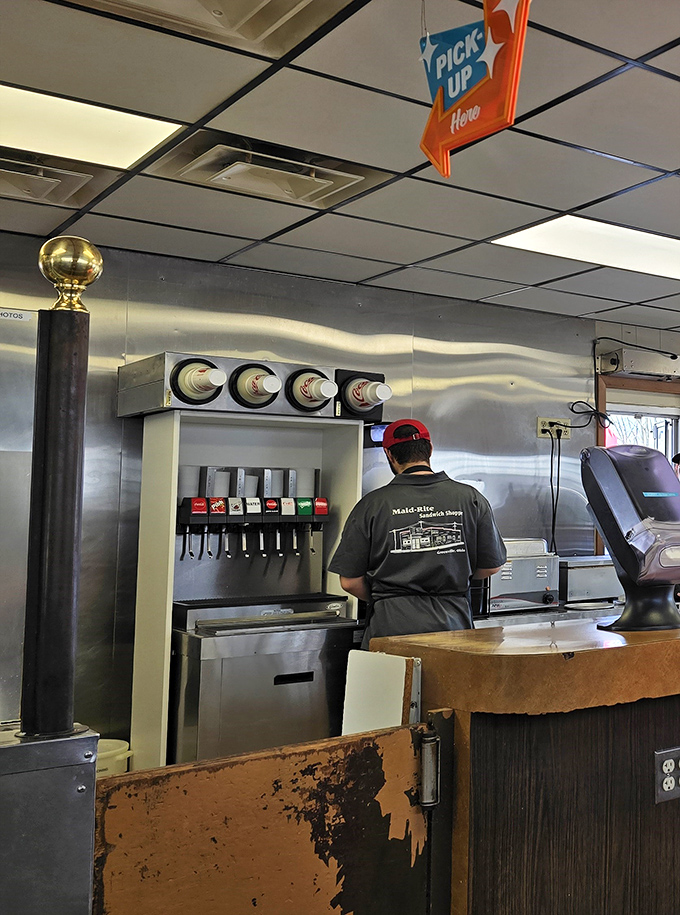 Behind the counter magic happens with practiced efficiency. This isn't cooking; it's a choreographed ritual perfected over decades.