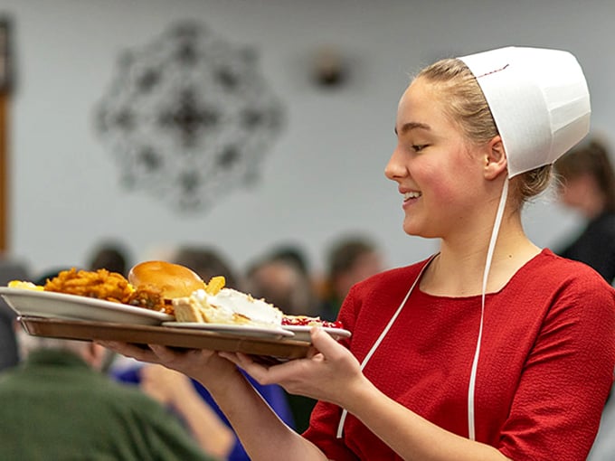 Authentic Amish hospitality served with a smile&mdash;traditional attire honors heritage while plates honor your appetite with generous portions.