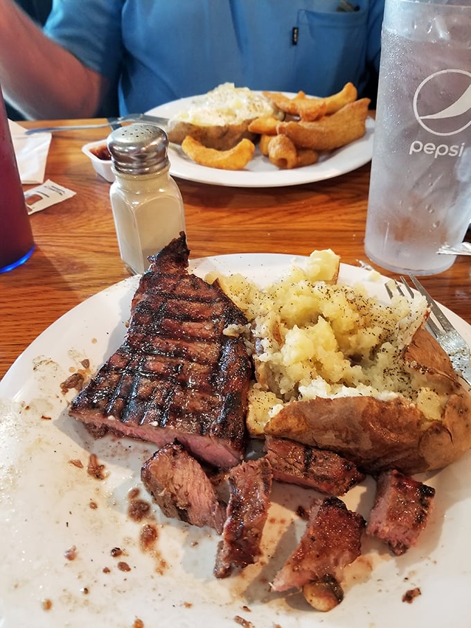 A steak that's seen just enough flame to know it's been cooked, paired with a potato that's practically begging to be your new best friend.