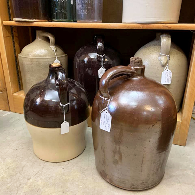 Stoneware jugs stand like sentinels of a bygone era when containers weren't just functional but built to outlast their makers.