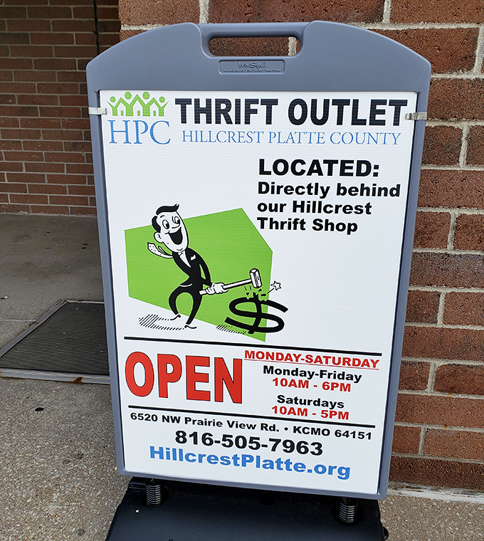 The sidewalk sign reveals the existence of a "Thrift Outlet" behind the main store&mdash;like finding a secret level in your favorite video game.