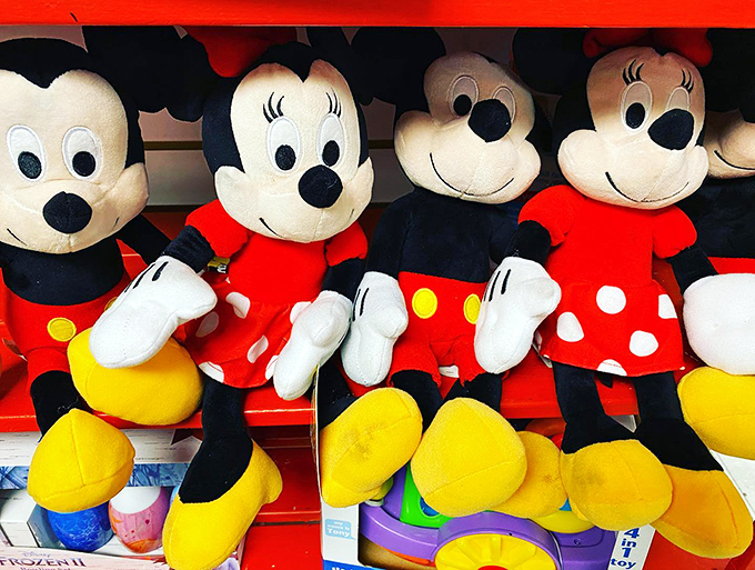 Mickey and Minnie, sitting in a row, waiting for a child to take them home and love them so.