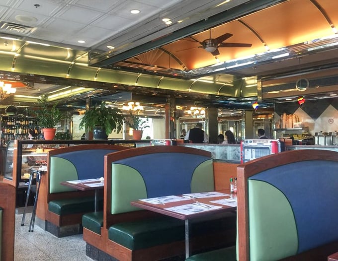 The booths aren't just seating&mdash;they're time machines upholstered in teal vinyl, ready to transport you to the golden age of American dining.