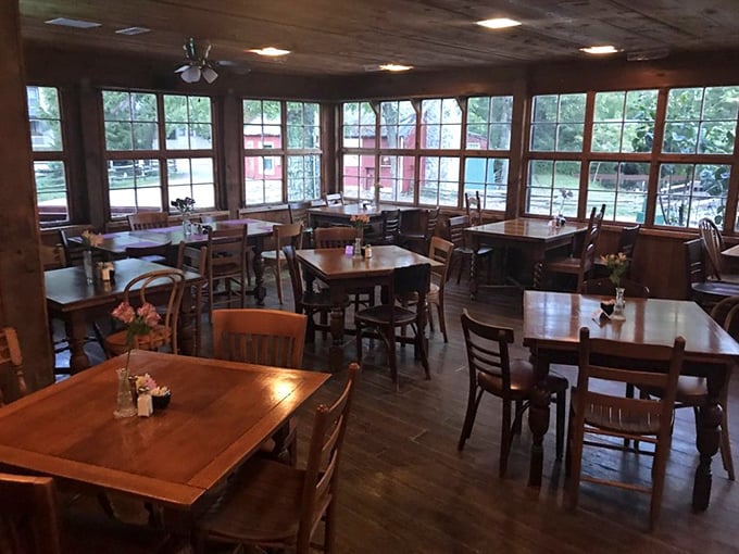 Sun-drenched dining room where windows frame the mill's picturesque surroundings&mdash;nature's artwork paired perfectly with your breakfast.