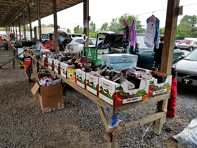 Fruit boxes repurposed as display tables&mdash;the ultimate in flea market ingenuity. Every vendor brings their own creative merchandising approach.