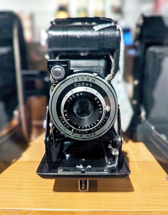 This vintage Kodak camera has captured countless moments in time, now preserved behind glass like the stories surrounding it.