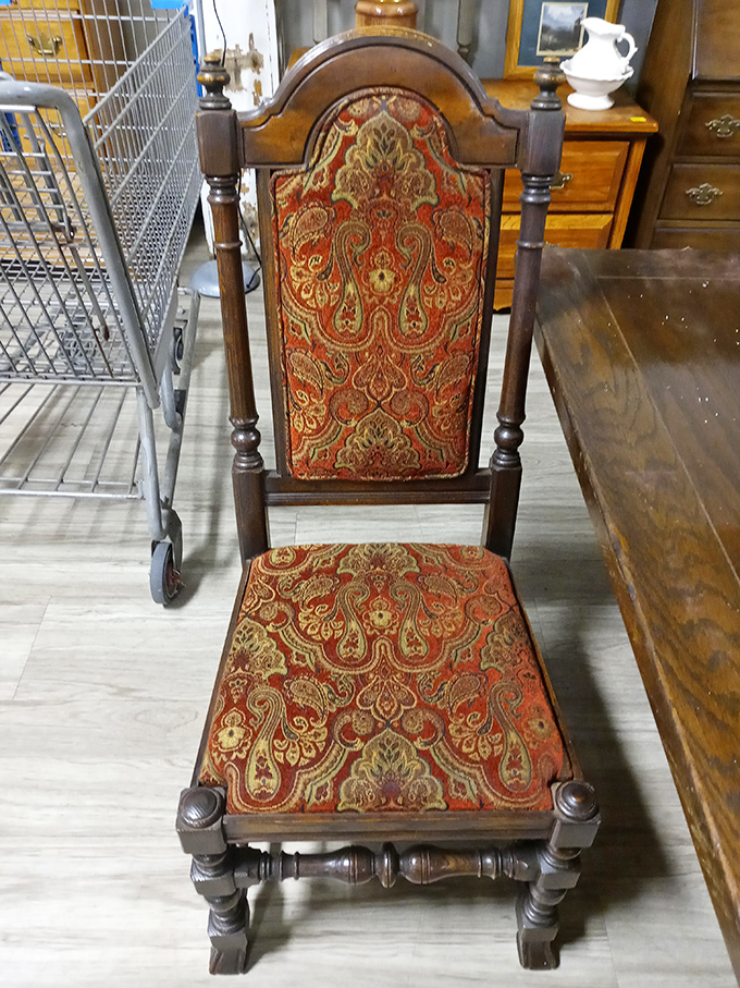 That ornate chair isn't just furniture &ndash; it's a time machine to a bygone era when dining rooms were formal and patterns were bold.