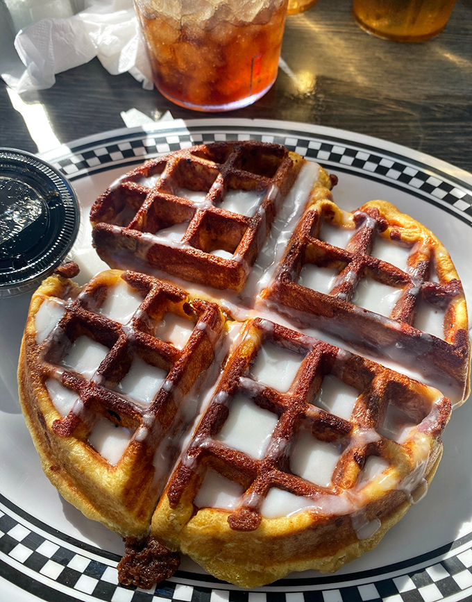 Golden waffles with perfect grid precision that would make any architect proud. That glaze isn't just topping &ndash; it's liquid happiness.