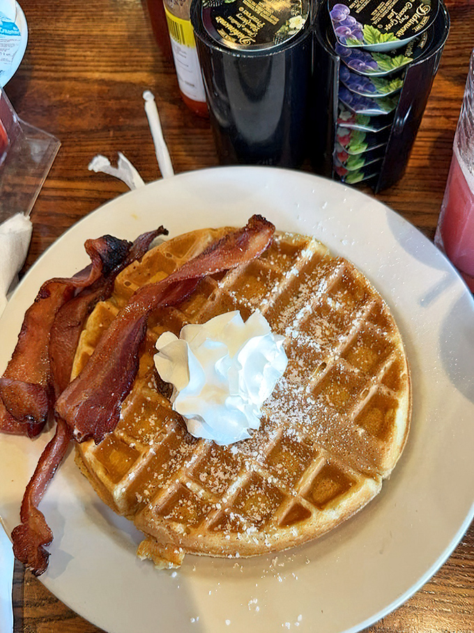 A waffle that's achieved the impossible trifecta: crispy exterior, fluffy interior, and bacon sidekick that's neither flabby nor burnt to a crisp.