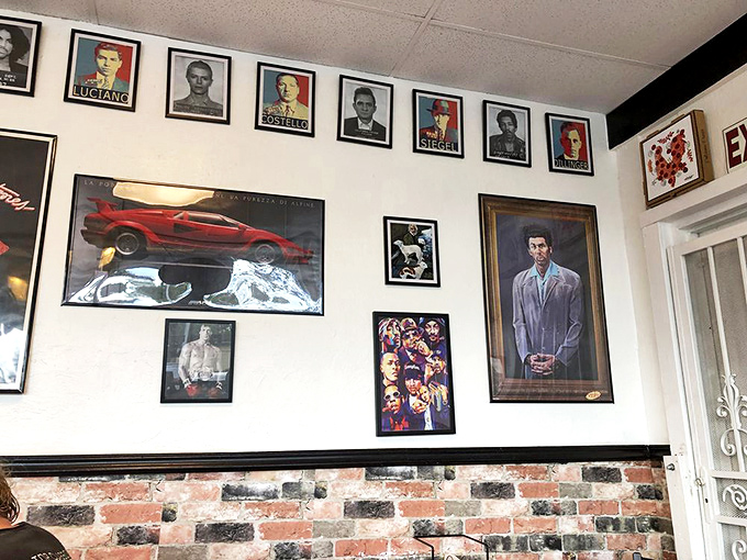 Movie posters and vintage signs create a nostalgic gallery that tells stories while you wait hungrily.