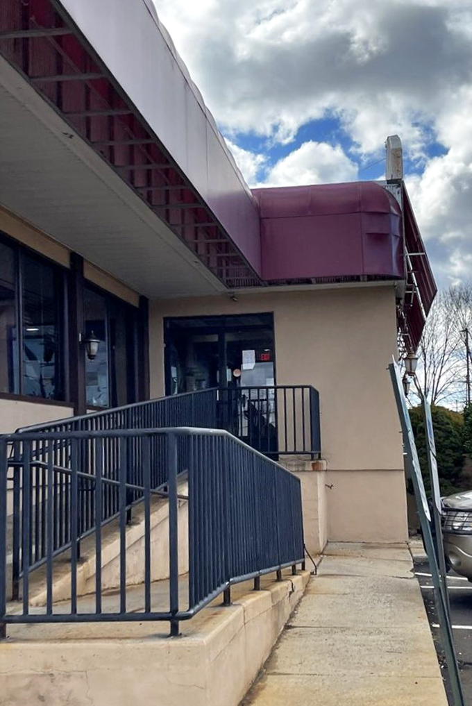 The entrance ramp says "accessible to all" while the red awning whispers "come hungry, leave happy" &ndash; a promise the Club House Diner keeps daily.