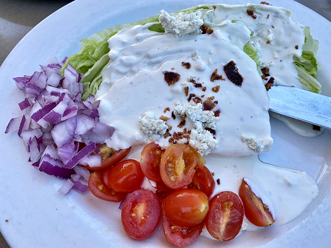 This wedge salad is what iceberg lettuce dreams of becoming when it grows up&mdash;draped in dressing with red onion and tomato companions.