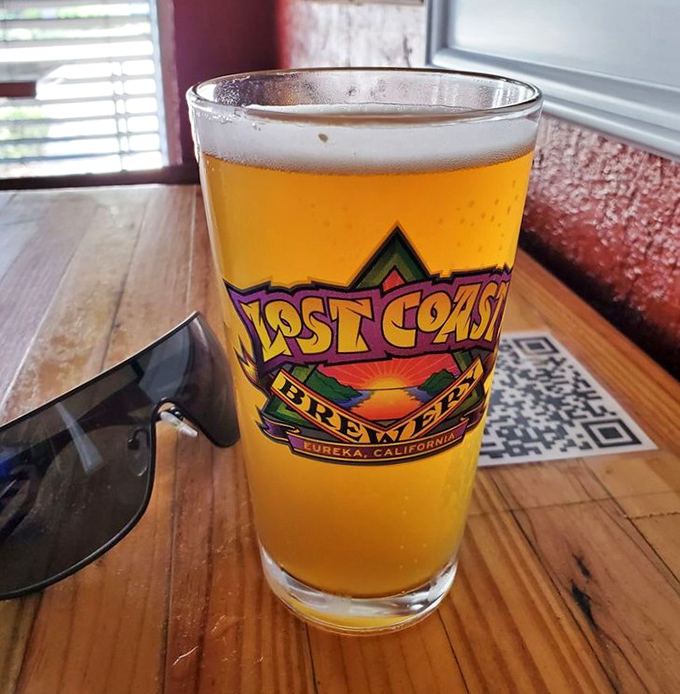 A golden glass of Lost Coast brew&mdash;because every great burger deserves an equally thoughtful liquid companion. The perfect pairing awaits.