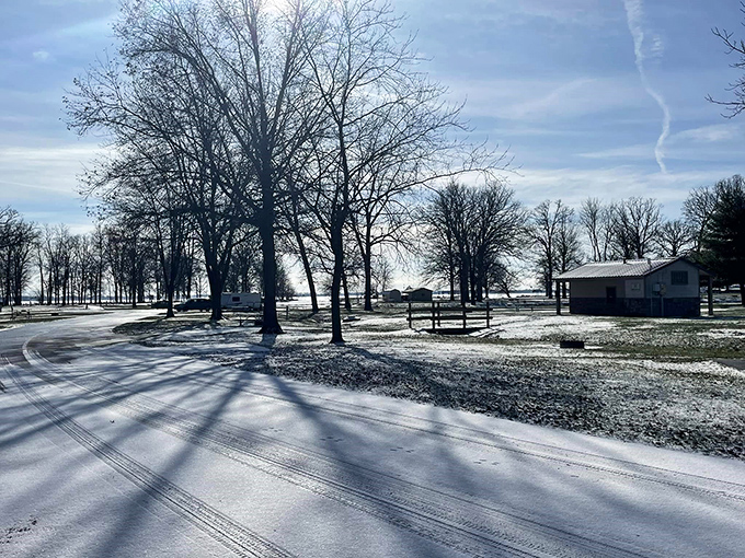 Winter transforms Indian Lake into a serene snow globe &ndash; those long shadows creating nature's sundial across the pristine white canvas.