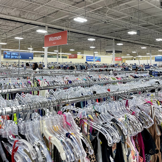 The women's clothing section stretches to the horizon like a fabric sea. Somewhere in this polyester ocean swims the perfect vintage dress.