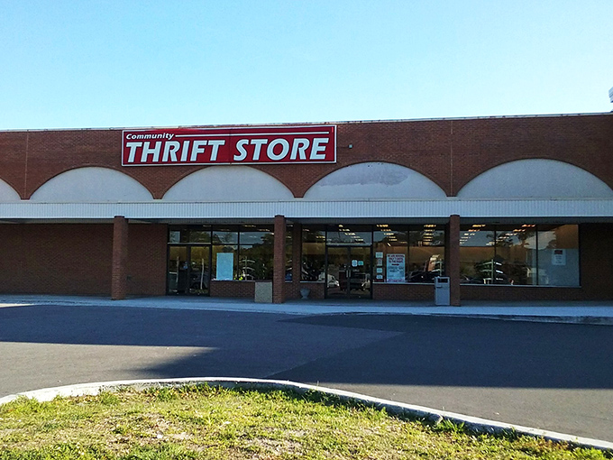 Community Thrift's distinctive arched storefront promises an afternoon of discovery. "We Are Open" might be the day's best news.