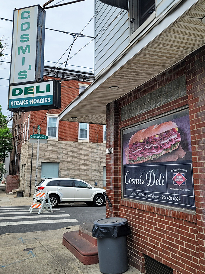 Cosmi's corner deli appearance might fool tourists, but locals know that green sign marks the spot for cheesesteak excellence.