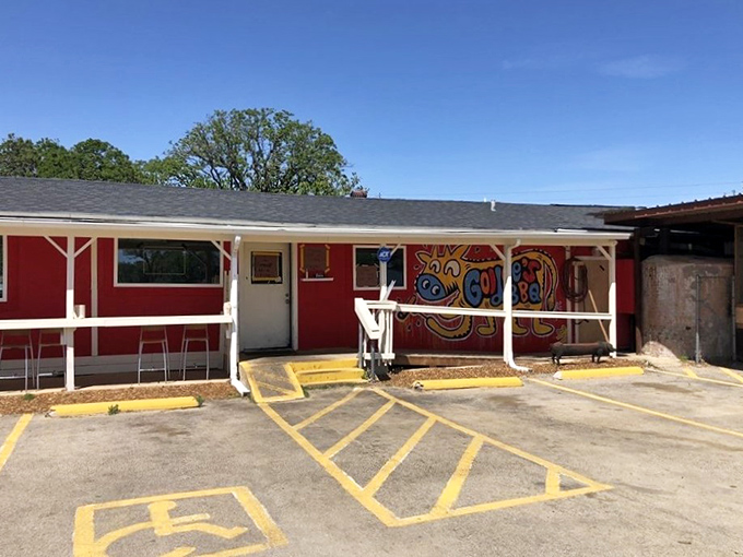 Goldee's vibrant red building sports a whimsical armadillo mural. Where Fort Worth's newest barbecue tradition is being written in smoke.