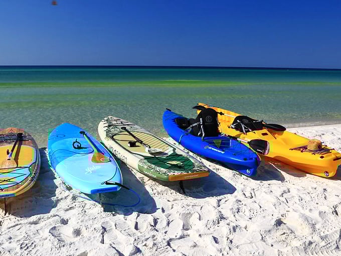 Kayaks and paddleboards wait patiently on Grayton Beach's shores, like colorful toys ready for grown-up playtime.