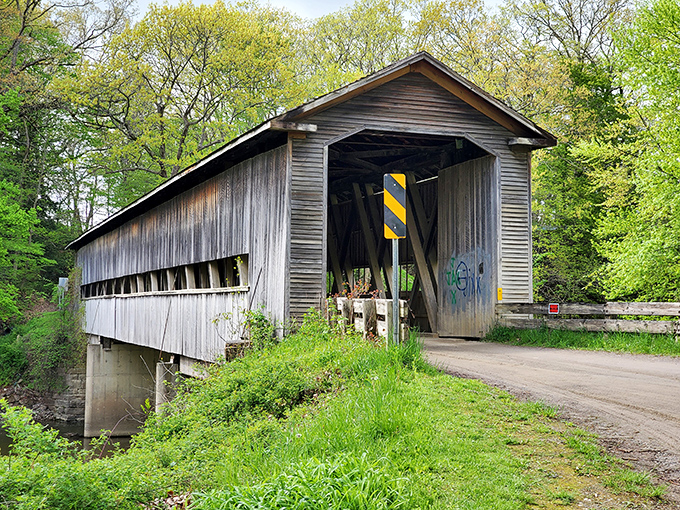 Middle Road Bridge waits like a wooden portal to simpler times. Those shadows inside dance with each passing car.