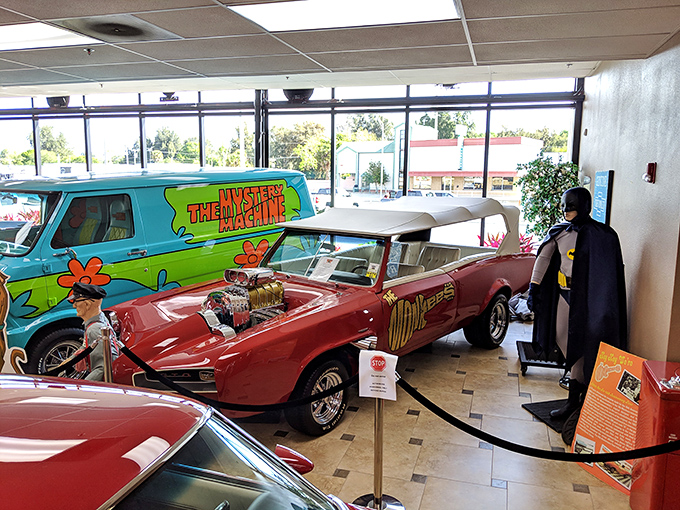 Gas pumps and neon signs create the perfect retro atmosphere at Ideal Classic Cars, where yesterday's dreams are parked and polished.