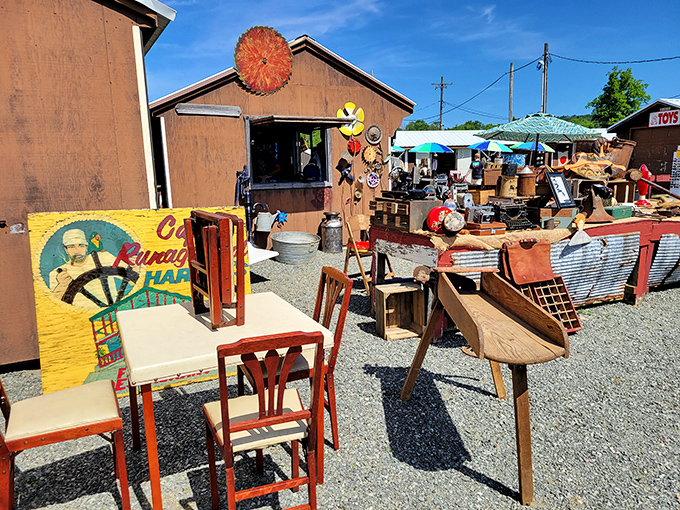 Vintage vignettes under open skies. Jake's outdoor section creates impromptu living rooms where yesterday's furniture awaits tomorrow's homes.
