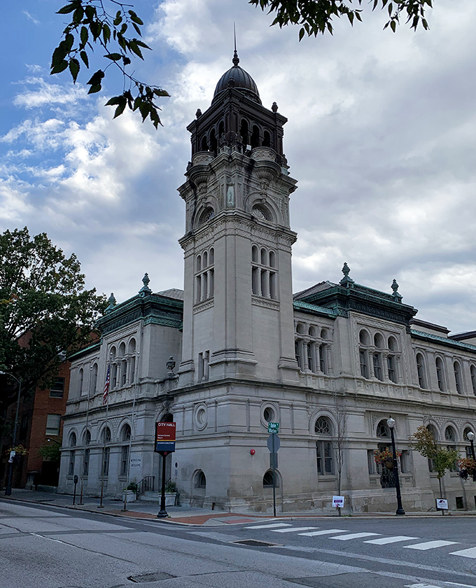Lancaster's clock tower stands tall against cloudy skies, keeping time for generations. A masterpiece of white stone elegance!