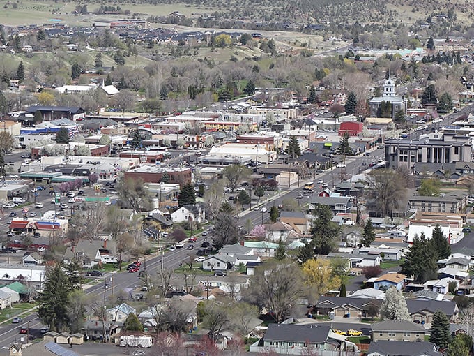 Prineville's aerial view reveals a charming small town nestled among rolling hills, where retirement dollars stretch like the horizon.