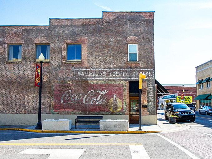 The vintage Coca-Cola ghost sign in Dayton whispers sweet tales of simpler times and ice-cold refreshment.