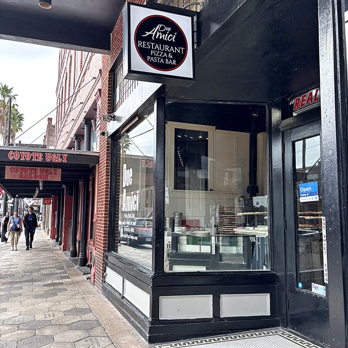 The classic brick fa&ccedil;ade of Due Amici whispers of pizza traditions passed down through generations. History you can taste.