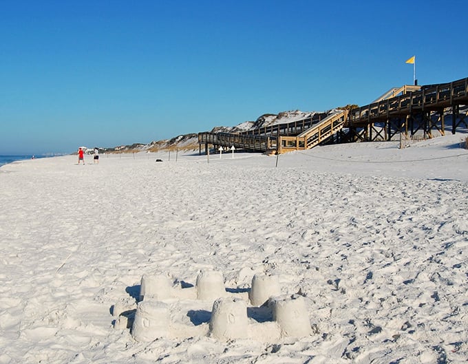 Grayton Beach's wooden boardwalks lead to sugar-white sands that feel like walking on powdered sugar without the sticky aftermath.
