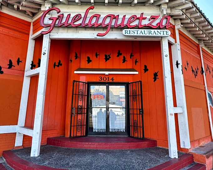 The neon "OPEN" sign is just a formality &ndash; the glowing orange building and distinctive architecture are the real beacons.