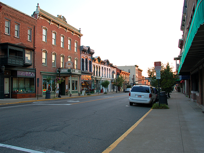 Tree-lined streets in small towns create natural canopies that make every walk feel like a peaceful meditation.