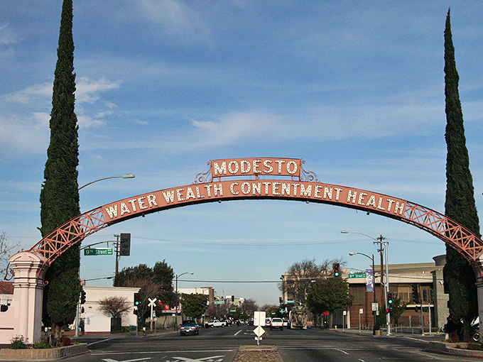 The famous Modesto arch welcomes visitors with promises of "Water, Wealth, Contentment, Health"&mdash;and we'd add "affordable retirement" to that list!