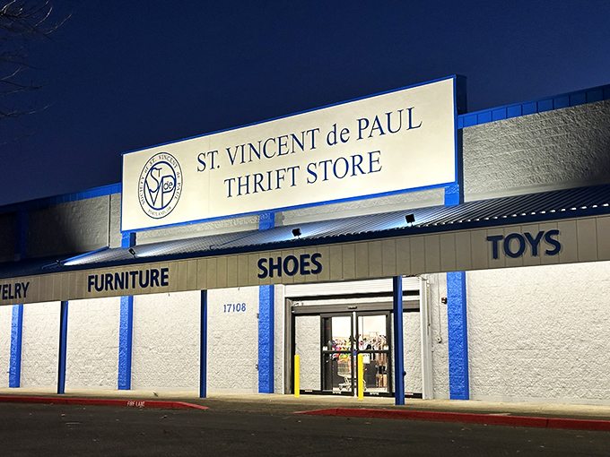 Even at night, St. Vincent's welcoming entrance promises tomorrow's treasures. Those "Furniture" and "Shoes" signs are just the beginning.