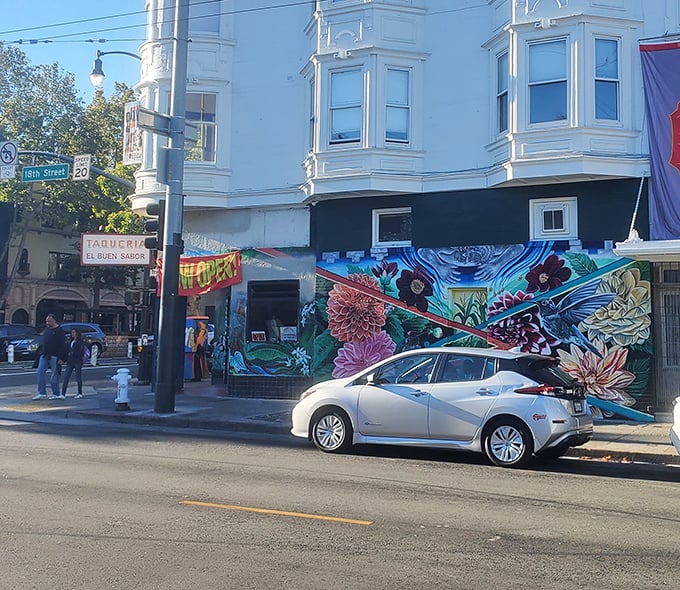 The colorful exterior hints at the flavor explosion waiting inside this neighborhood favorite. That mural is basically truth in advertising!