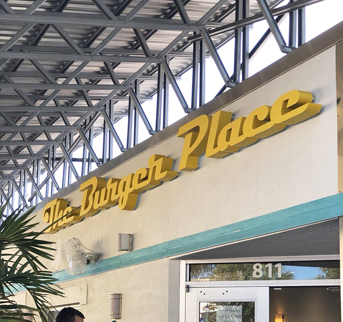 That yellow "Burger Place" sign is like a beacon of hope for the hungry &ndash; simple, straightforward, and promising delicious satisfaction.